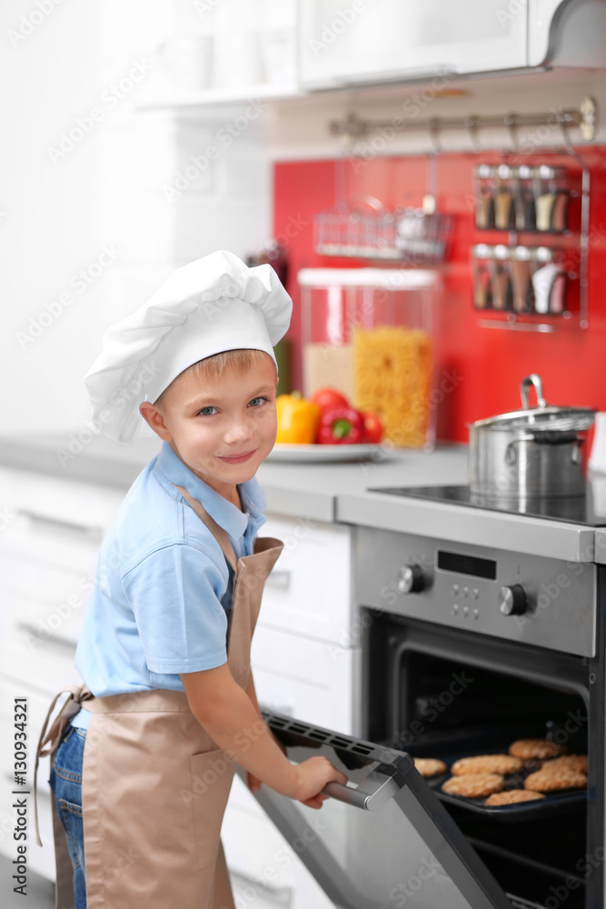 Little boy cooking in the kitchen Stock Photo | Adobe Stock