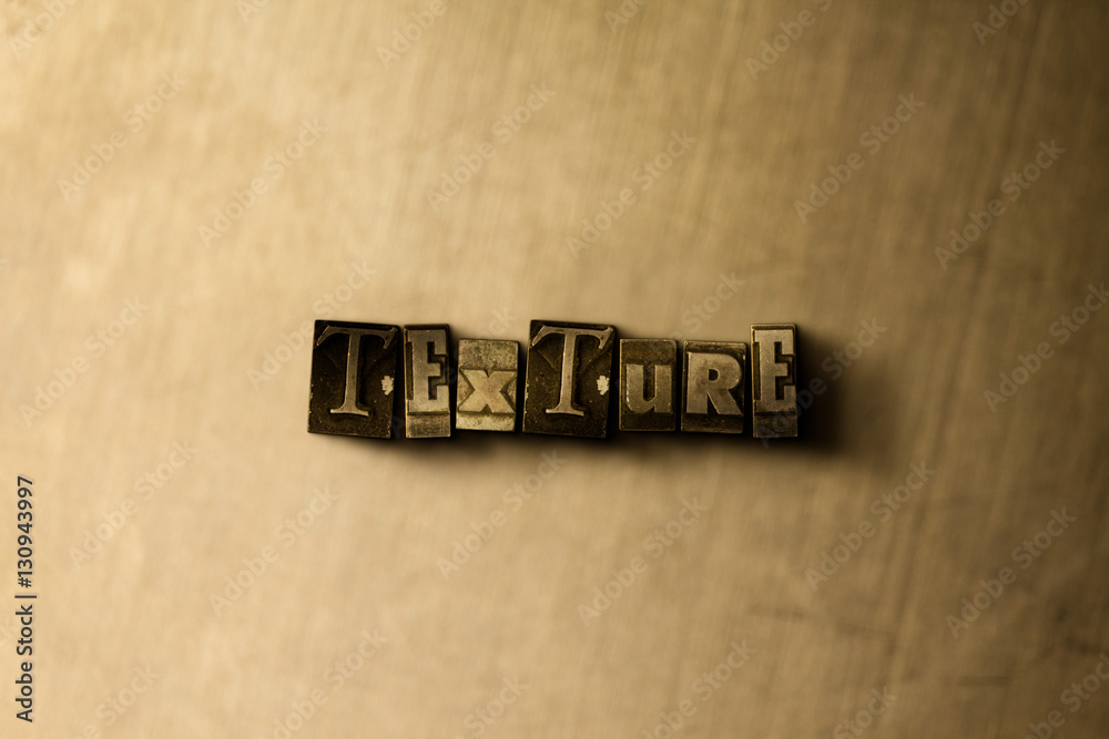 TEXTURE - close-up of grungy vintage typeset word on metal backdrop ...
