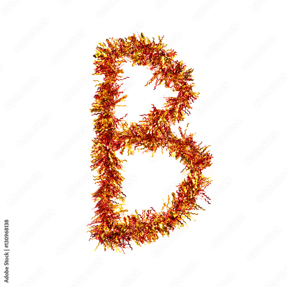 Festive alphabet made of red and yellow tinsel. Letter B on white ...