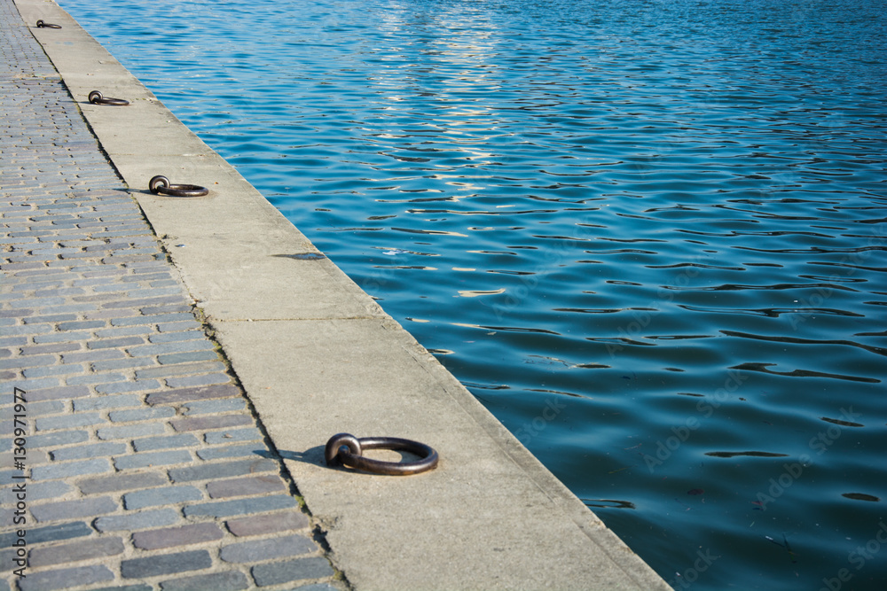 Mooring ring - Close up image with a solid iron ring used to secure the ...
