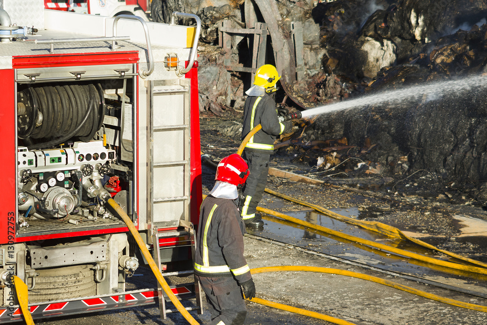 firefighters in industrial warehouse fire Stock Photo | Adobe Stock