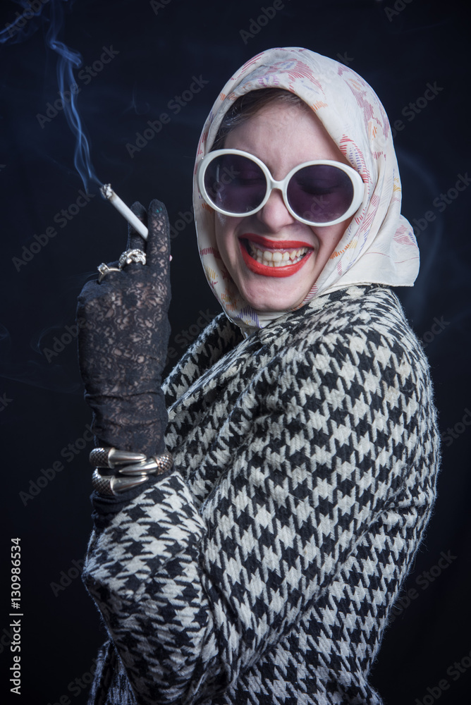 Young retro vintage woman smoking a cigarette and laughing, lady with ...