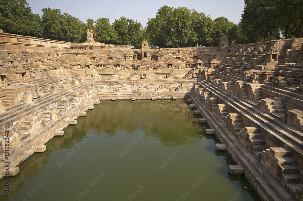 Ancient stepped water tank in front of the Sun Temple at Modhera ...