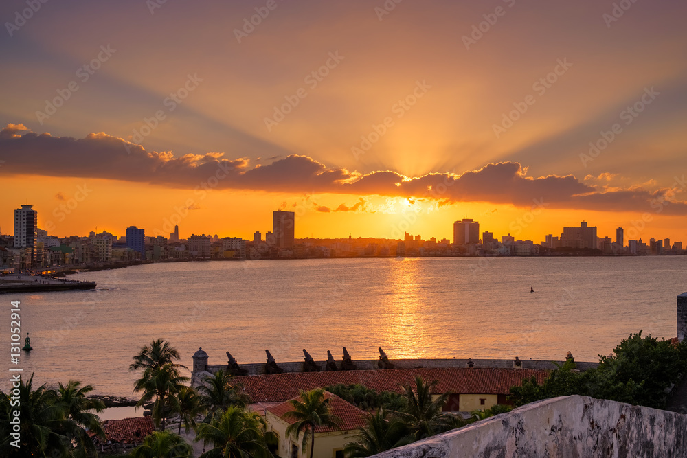 Beautiful sunset in Havana with the sun setting over the seaside ...