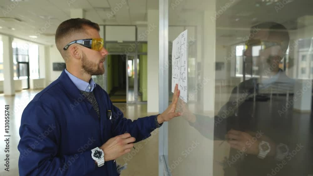 Vidéo Stock architect builder studying layout plan of the rooms ...