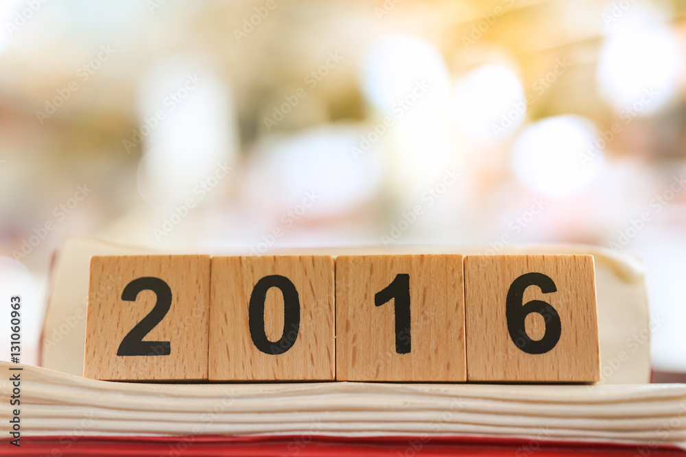 Wooden number block 2016 and 2017 on red book, for conuting End of Year ...