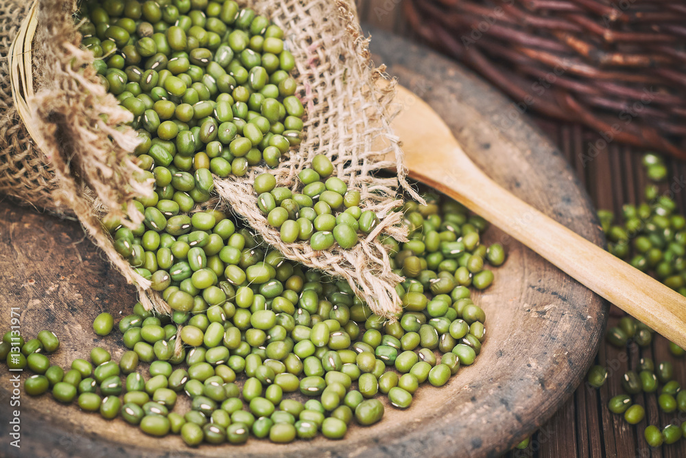 Raw mung beans (Vigna radiata) spilling from burlap bag Stock Photo ...