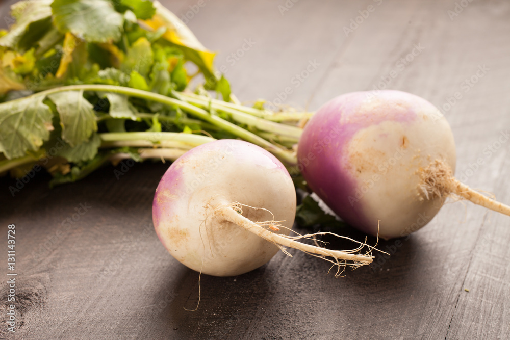 Foto Stock Freshly harvested organic turnips on a dark wooden ...
