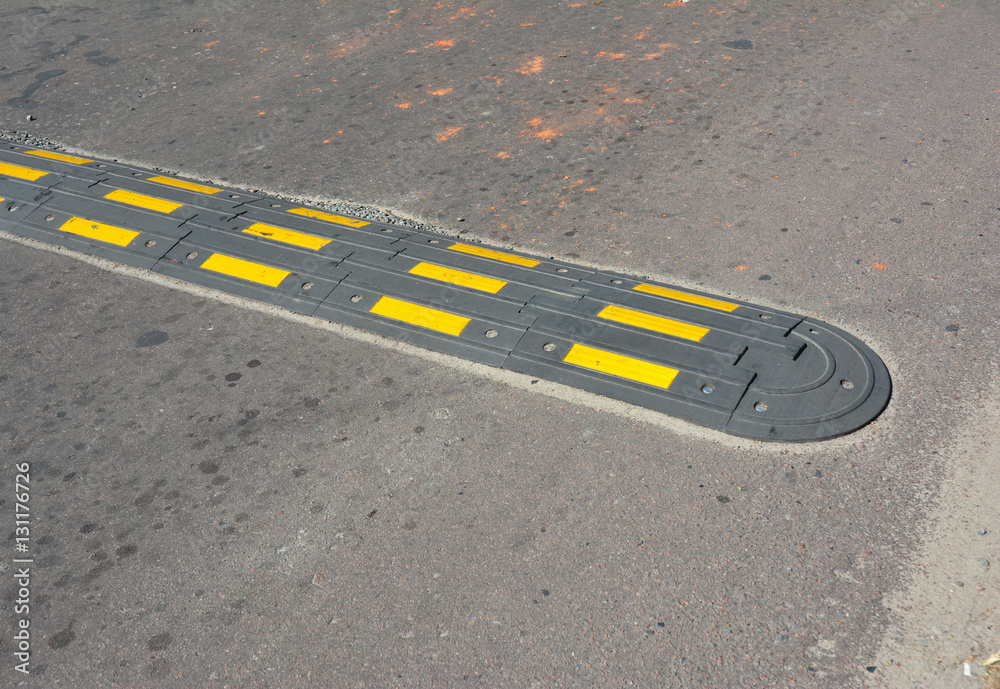 Traffic safety speed bump on an asphalt road. Speed bumps. Stock Photo ...