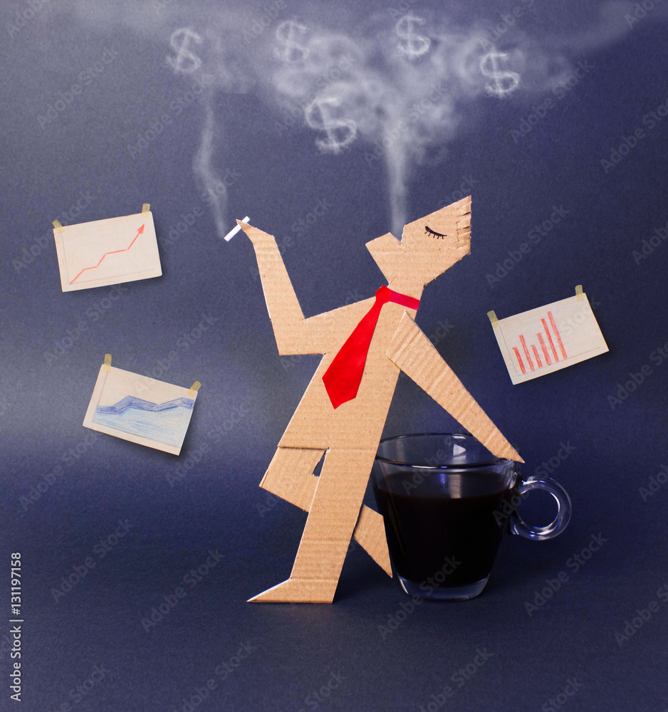 Paper man is a successful businessman smokes, blows smoke in the form ...