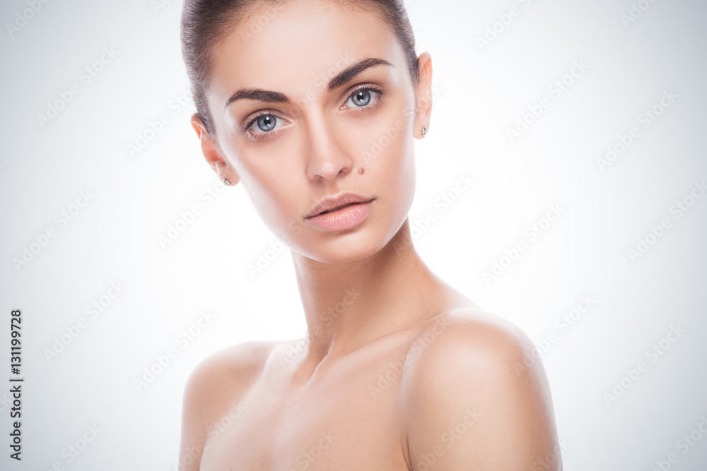 Closeup Portrait Of Young Adult Woman With Clean Fresh Skin Isolated On