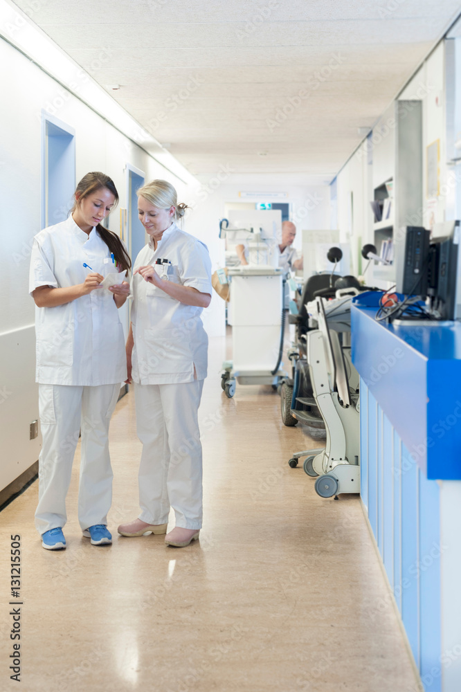 Nurses on hospital ward having discussion Stock Photo | Adobe Stock