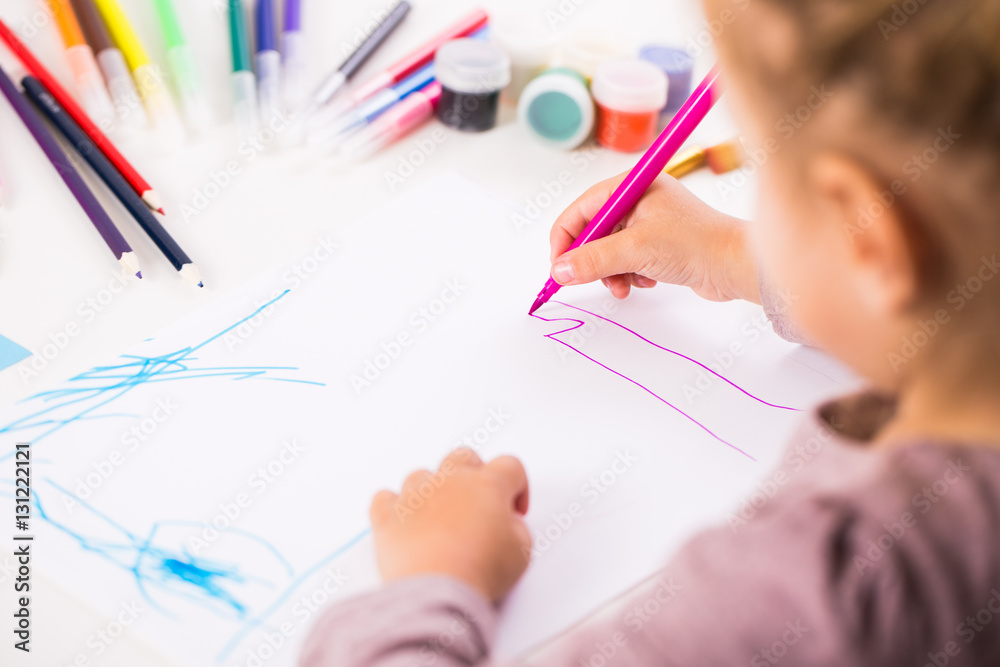 little girl drawing with colored pencils on paper Stock Photo | Adobe Stock