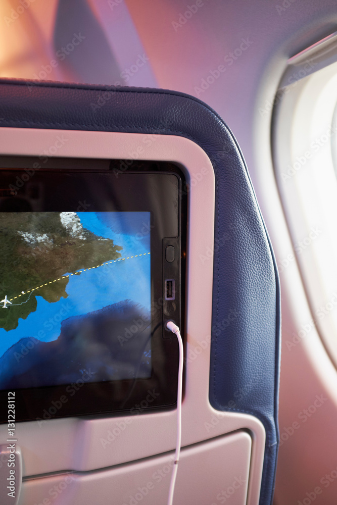 Computer screen route map on back of airplane seat Stock Photo | Adobe ...