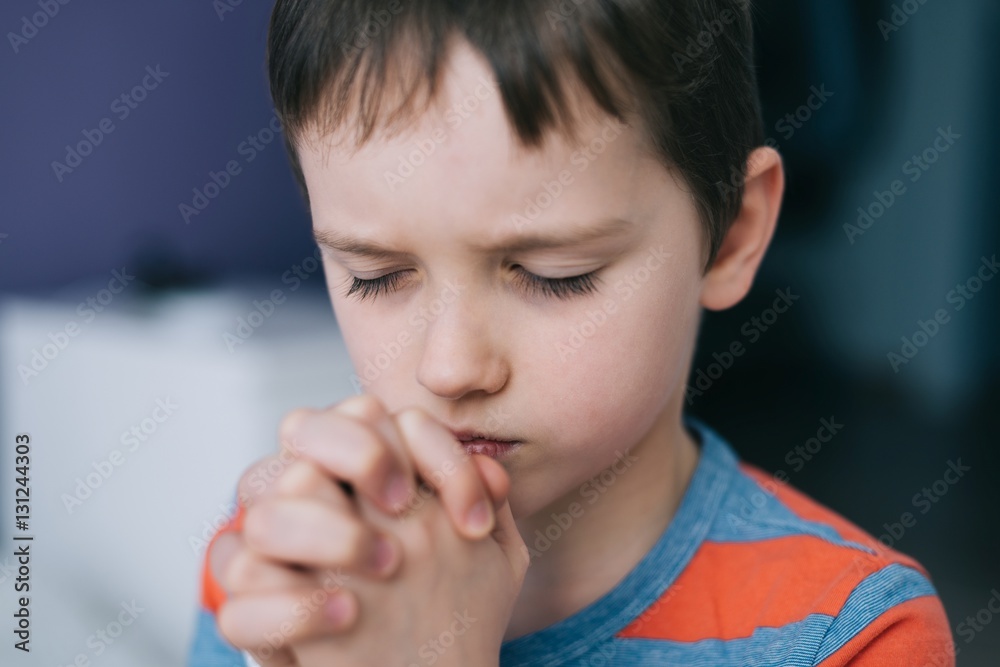 Little boy praying. Boy's prayer. Stock Photo | Adobe Stock