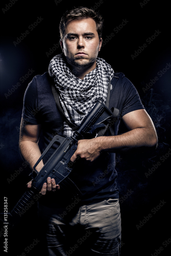 Soldier or mercenary wearing a shemagh with assault rifle, paintball or ...