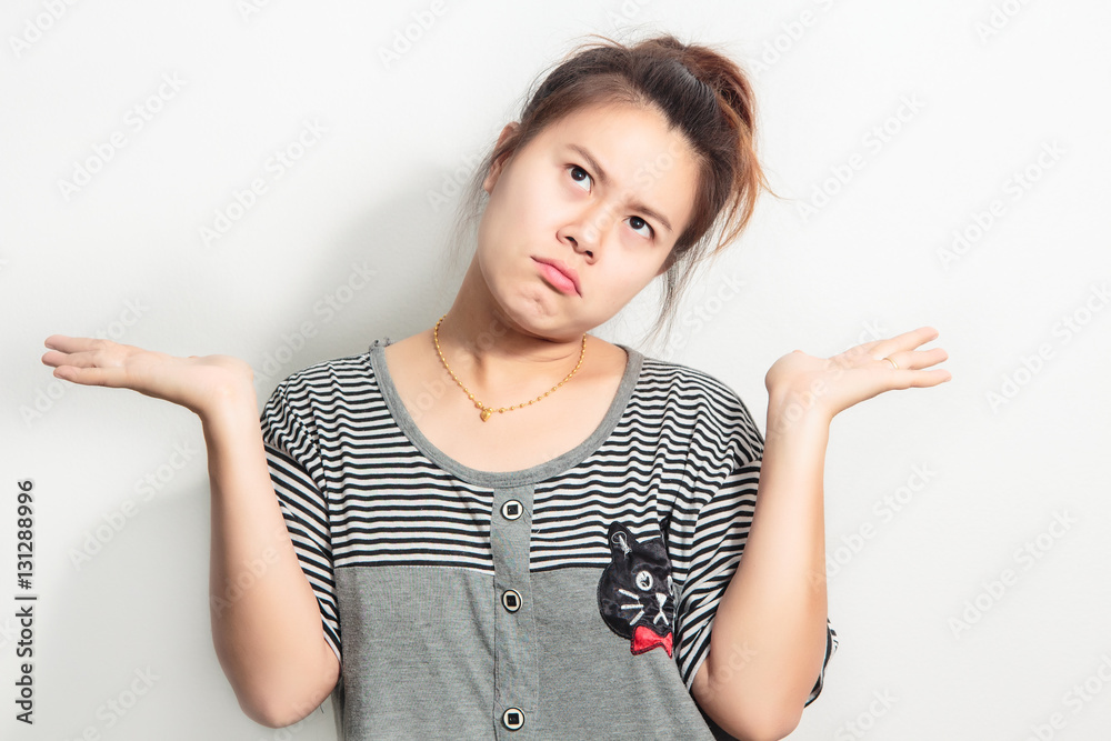 Portrait asia young woman arms out shrugs shoulders who cares so what I ...