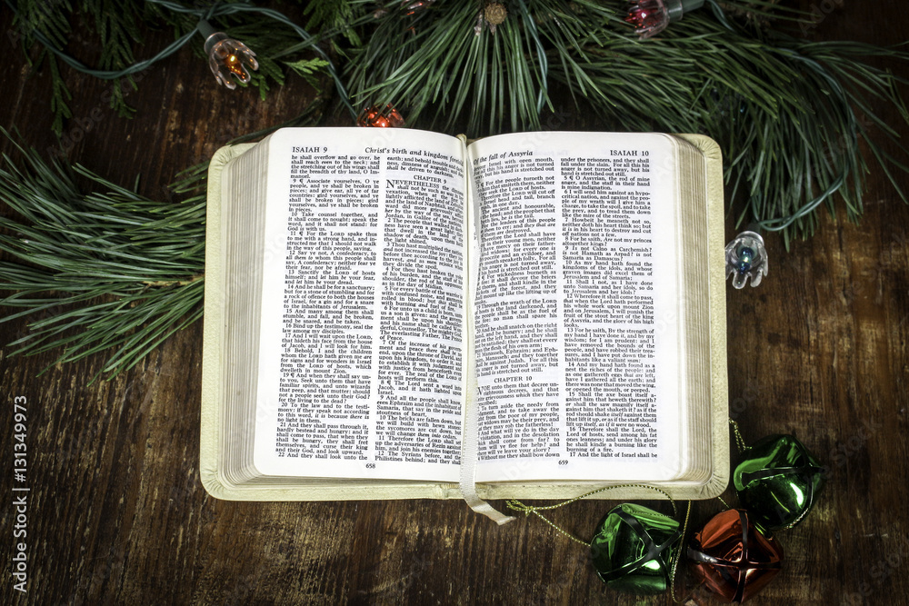 Open bible with bells and flowers Christmas Theme Stock Photo | Adobe Stock