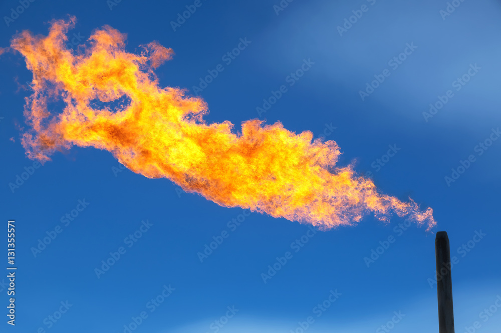 Gas flaring. Combustion of associated gas at oil production. Stock ...