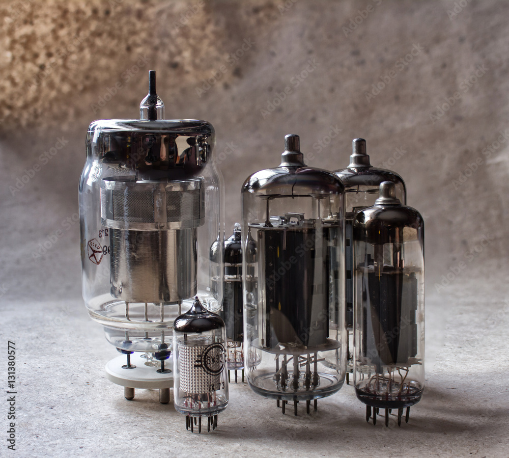 vertical composition of vacuum tubes on kraft paper. vintage electronic ...