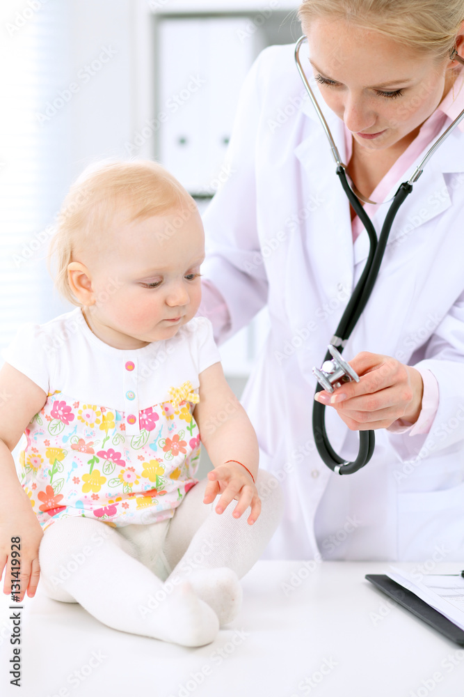 Pediatrician is taking care of baby in hospital. Little girl is being ...