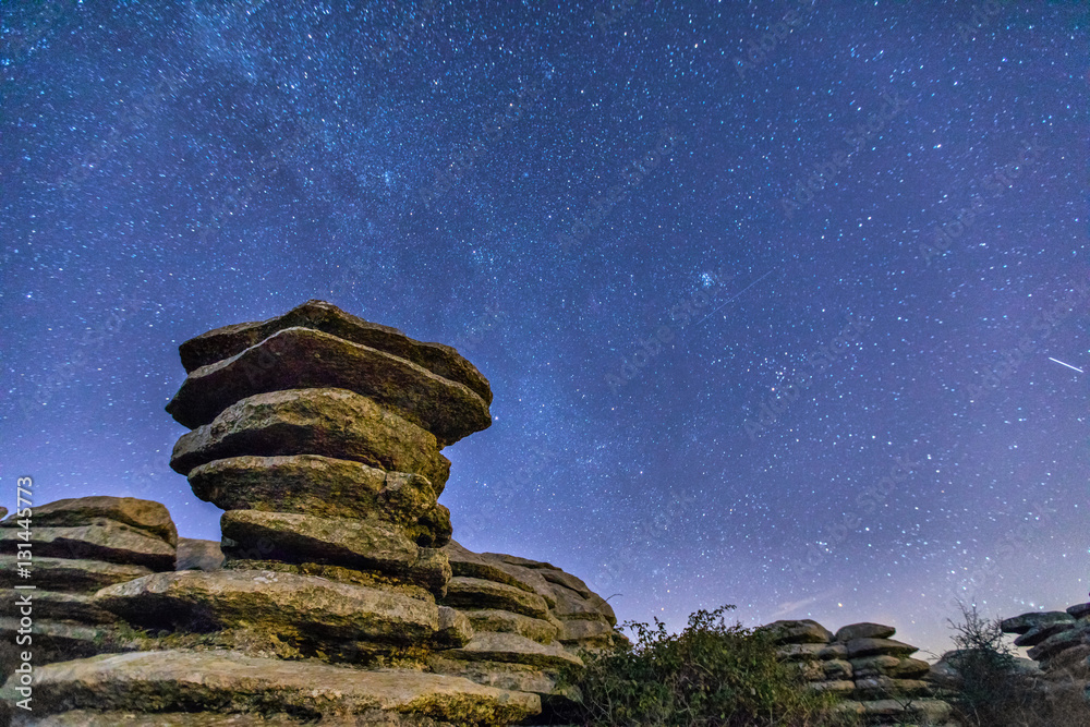 Schistous rock on the starry sky background at night in El Torcal de ...