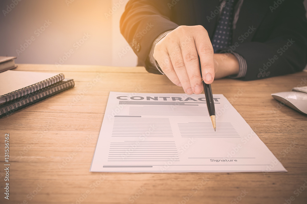 Businessman points on signature line on contract in office. Stock Photo ...