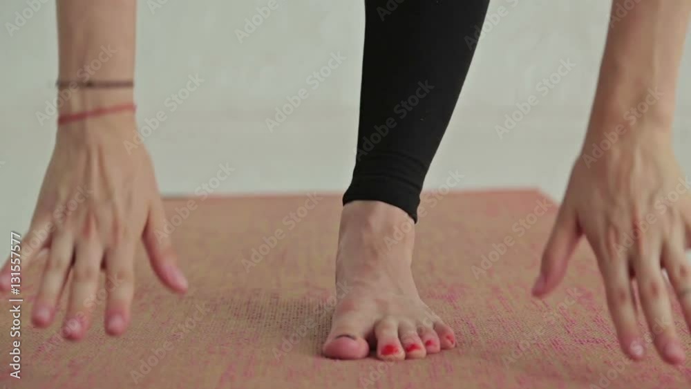 Young sporty woman practicing yoga in fitness studio - ardha baddha ...