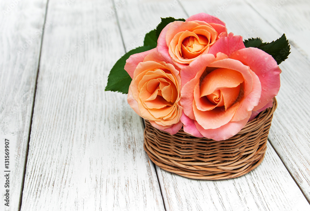 Basket with Pink roses Stock Photo | Adobe Stock