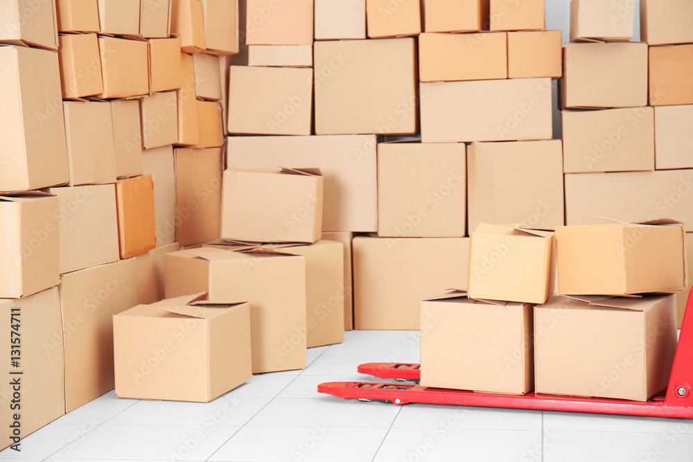 Manual pallet truck with carton boxes Stock Photo | Adobe Stock