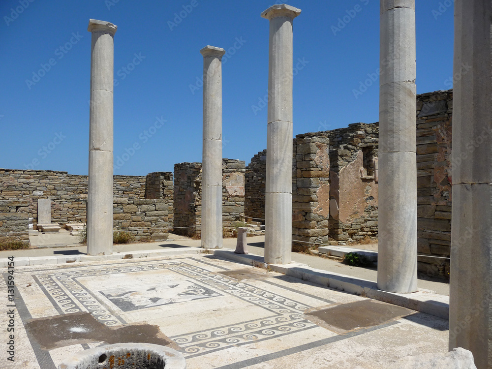 Ruins of an ancient Greek temple with mosaic on a floor and white ...