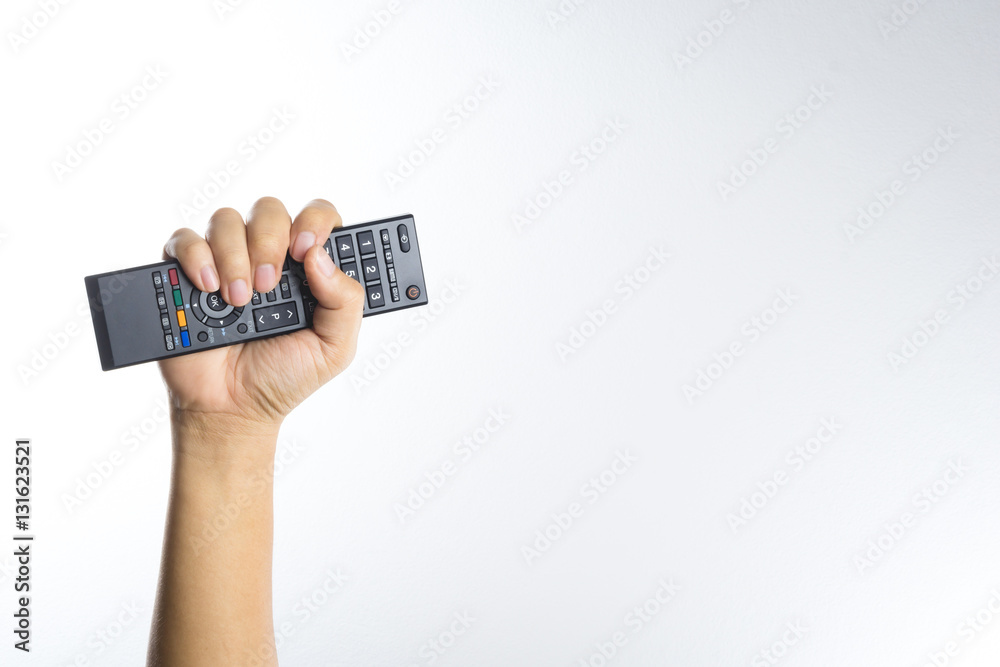 Hand with remote control Stock Photo | Adobe Stock
