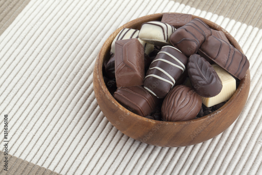 assorted chocolate in wooden bowl Stock Photo | Adobe Stock