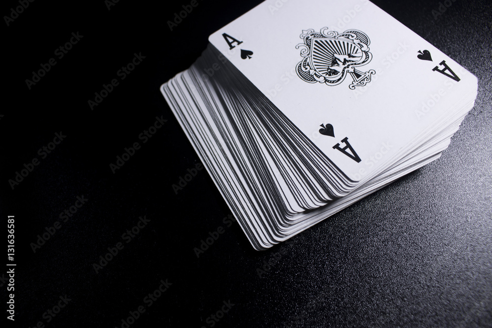 poker card stack deck on dark black background Stock Photo | Adobe Stock