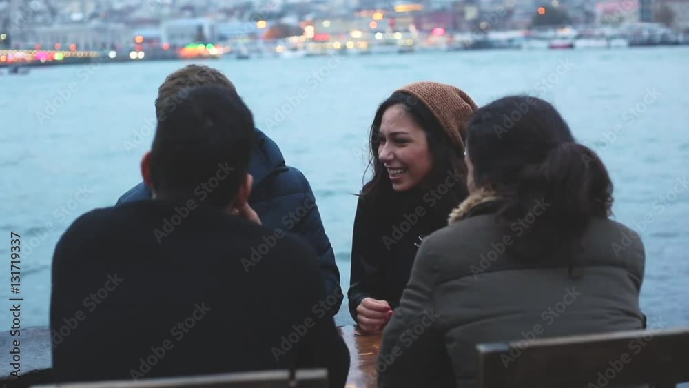 Group of Turkish friends drinking cay, traditional tea in Turkey. They ...