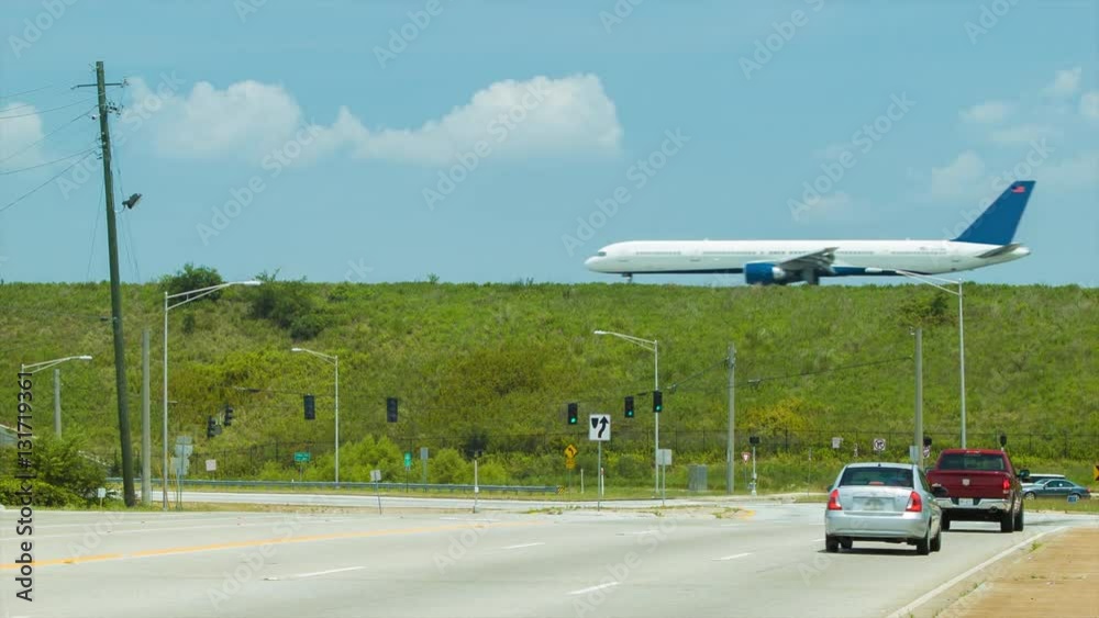 Cars Driving on Roads Next to Atlanta Airport with a Passing generic ...