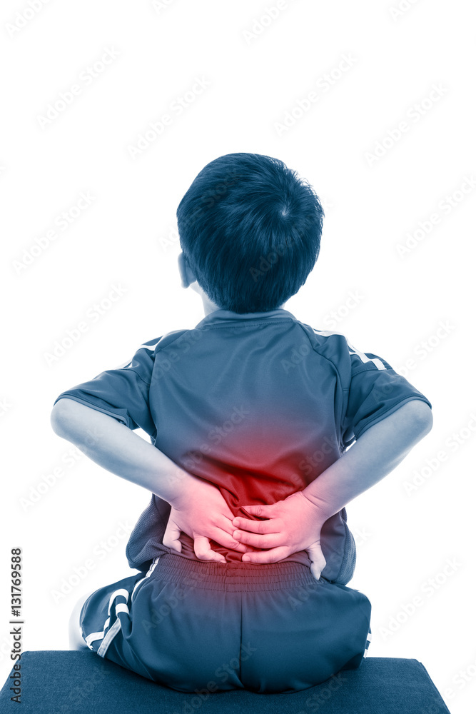 Back pain. Child rubbing the muscles of his lower back. Isolated on ...