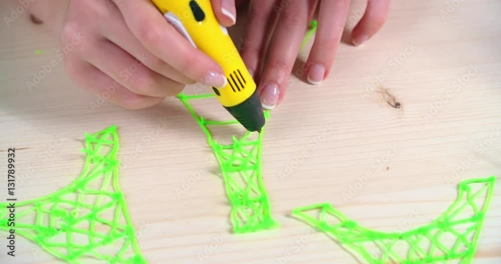 Female hands drawing models of Eiffel towers with 3d printing pen Stock ...