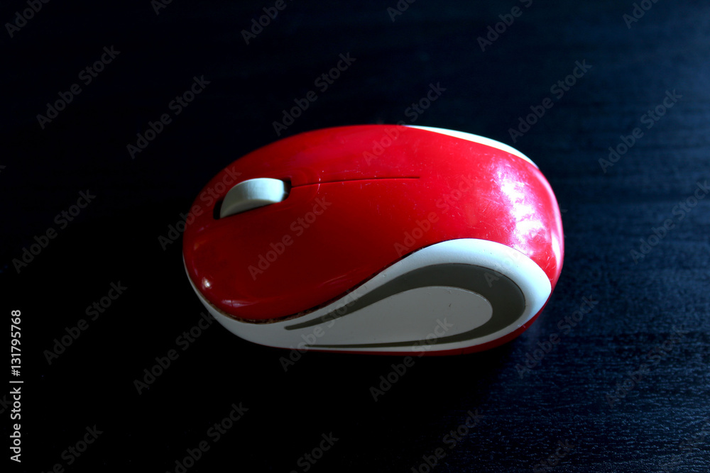 red computer mouse on the black background Stock Photo | Adobe Stock