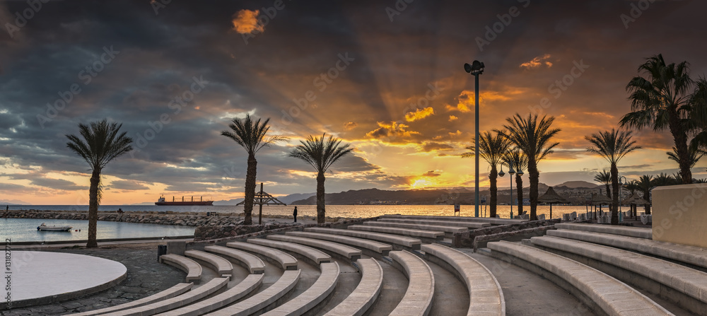 Colorful sunset at the Red Sea; panoramic view from stone amphitheater ...