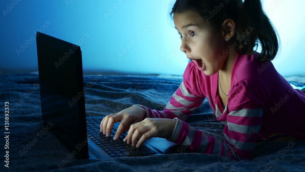 Teen angry girl evil surprise working at laptop, the Internet play in ...