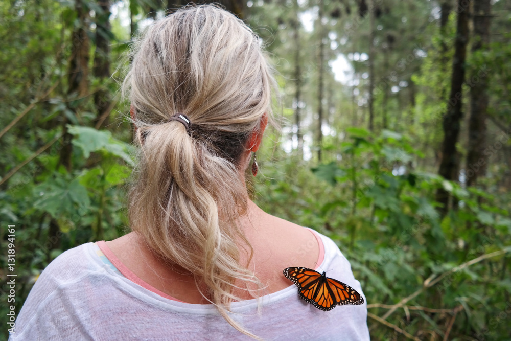 Monarch Butterfly sitting on the back of a person foto de Stock | Adobe ...