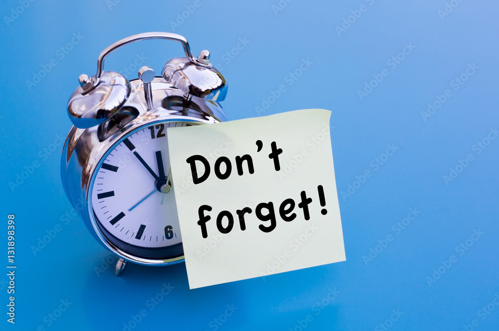 alarm clock with sticker with words Dont Forget Stock Photo | Adobe Stock