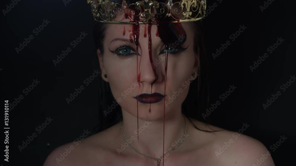 4k shoot of a horror Halloween model - Vampire with crown and blood on ...