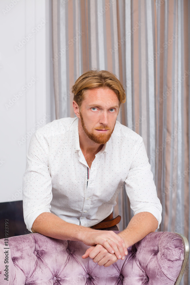 Portrait of confident rich man or businessman posing for photographer ...
