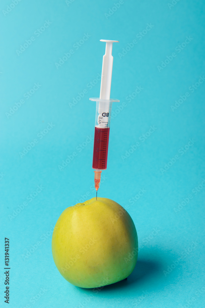 Chemical additives in food or genetically modified fruit concept. Stock ...