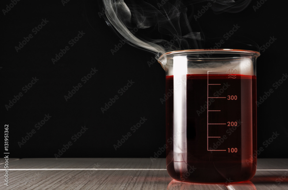 The glass beaker in which a chemical reaction occurs. Stock Photo ...