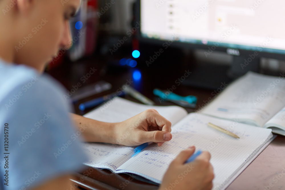 Teenage student doing homework Stock Photo | Adobe Stock