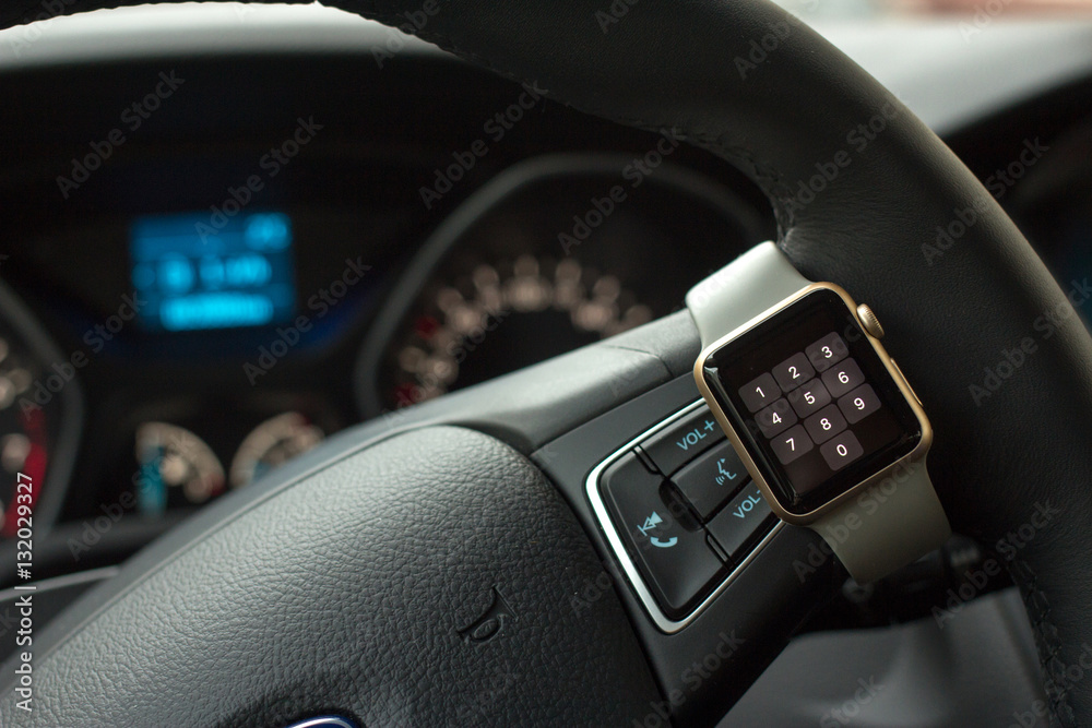 Modern car interior with smart watch on steering wheel Stock Photo ...