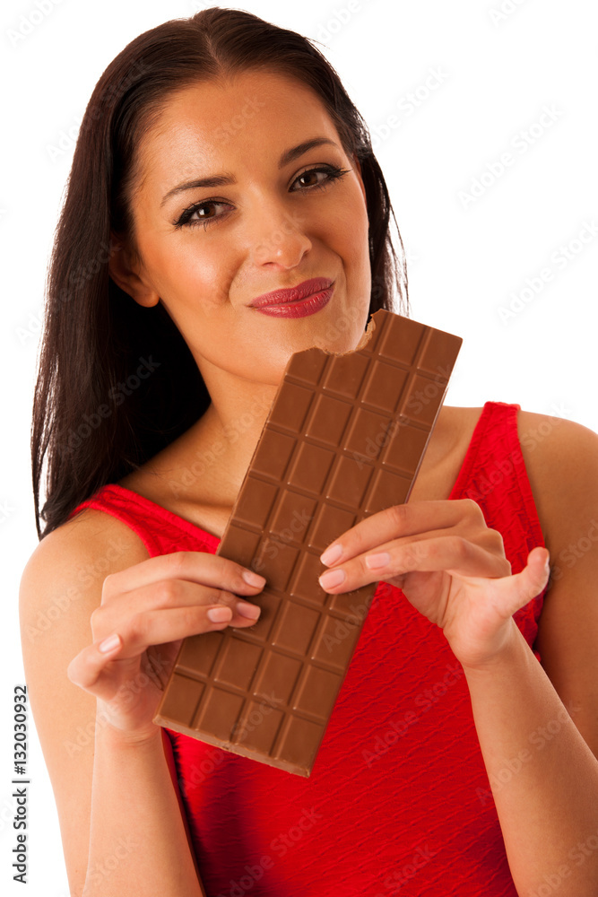 Beautiful young woman eats chocolate isolated over white backgro Stock ...